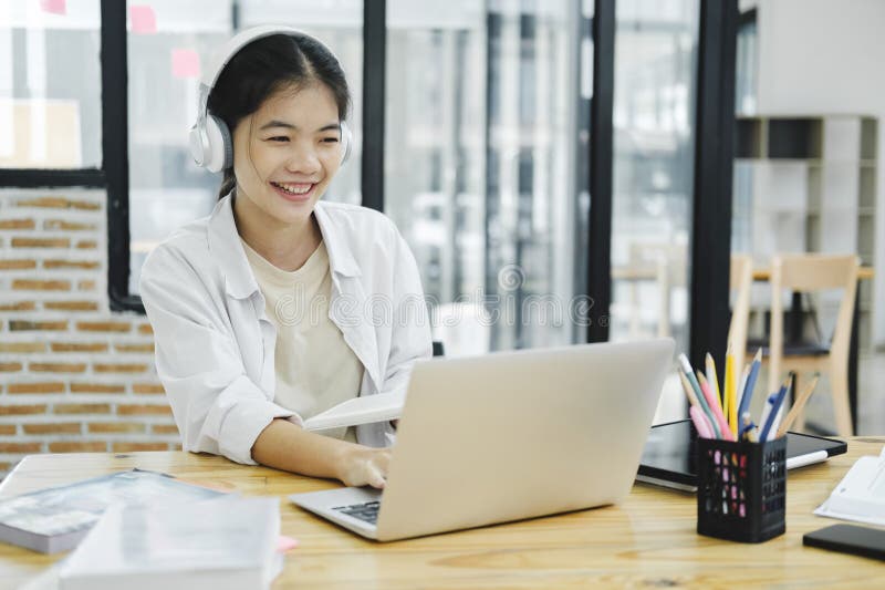 Young Collage Student Using Computer and Mobile Device Studying Online ...