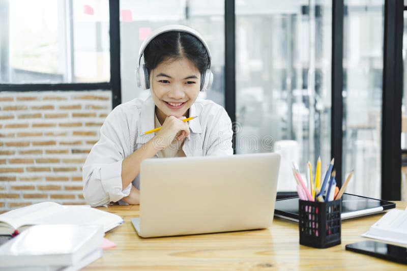 Young Collage Student Using Computer and Mobile Device Studying Online ...