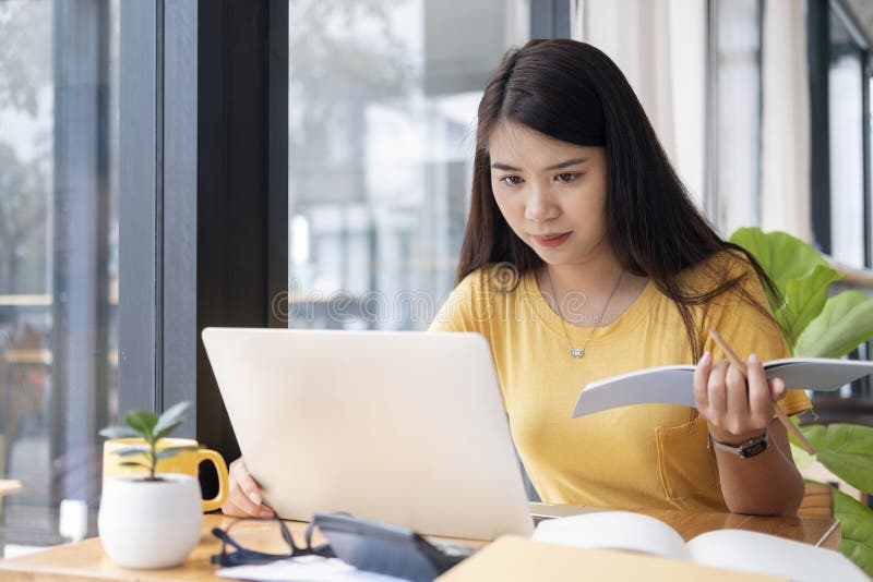 Young Collage Student Using Computer and Mobile Device Studying Online ...