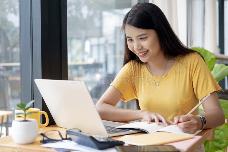 Young Collage Student Using Computer and Mobile Device Studying Online ...