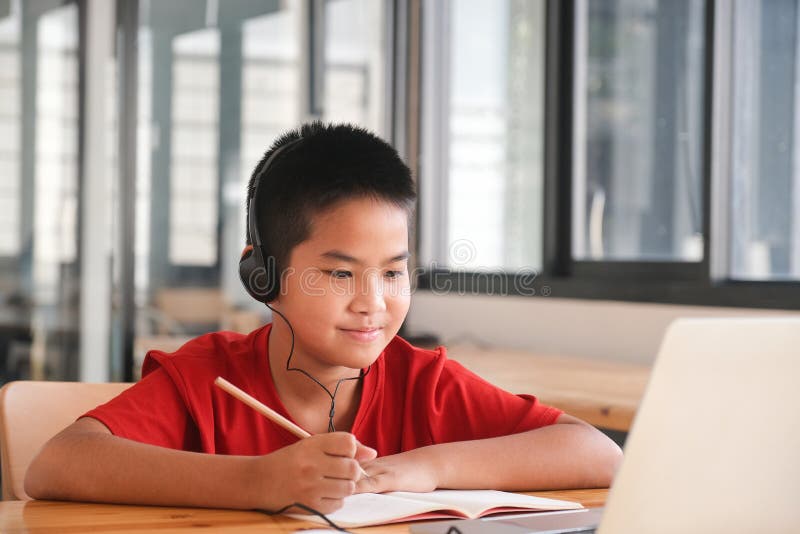 Young Collage Student Using Computer and Mobile Device Studying Online ...