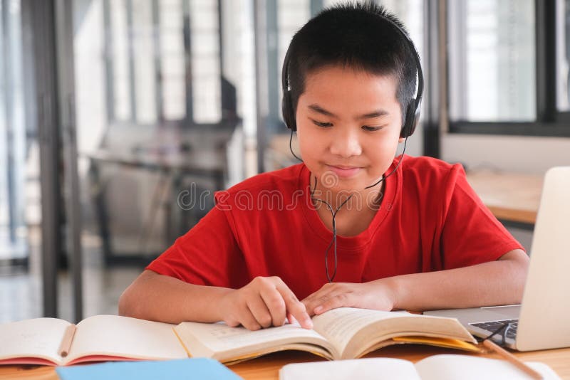 Young Collage Student Using Computer and Mobile Device Studying Online ...