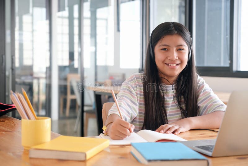 Young Collage Student Using Computer and Mobile Device Studying Online ...