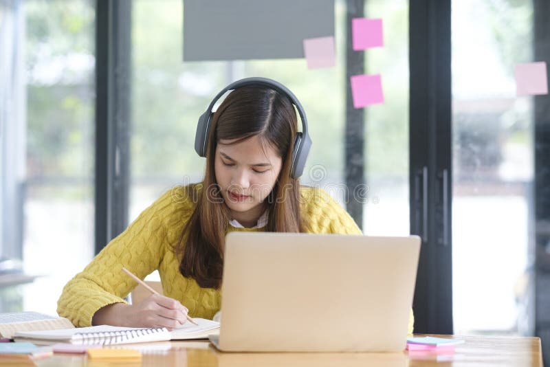 Young Collage Student Using Computer and Mobile Device Studying Online ...