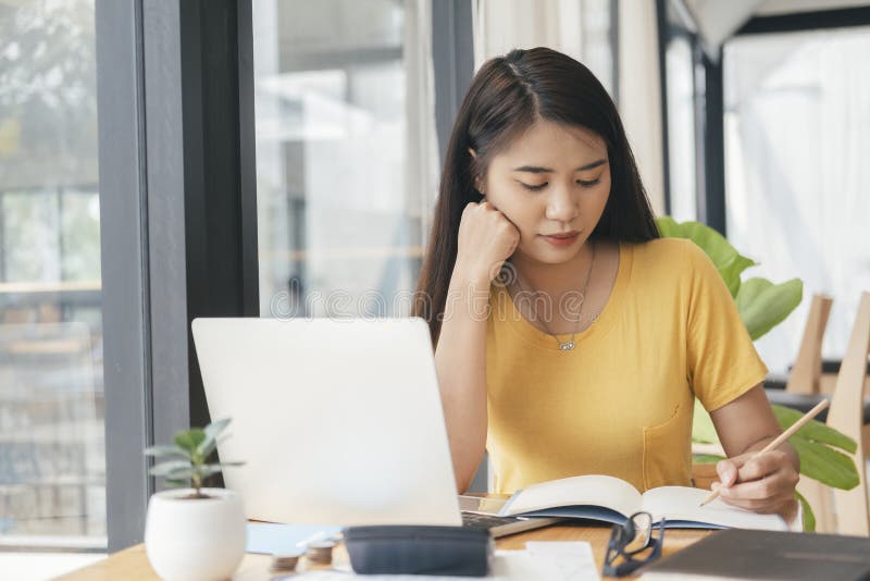 Young Collage Student Using Computer and Mobile Device Studying Online ...