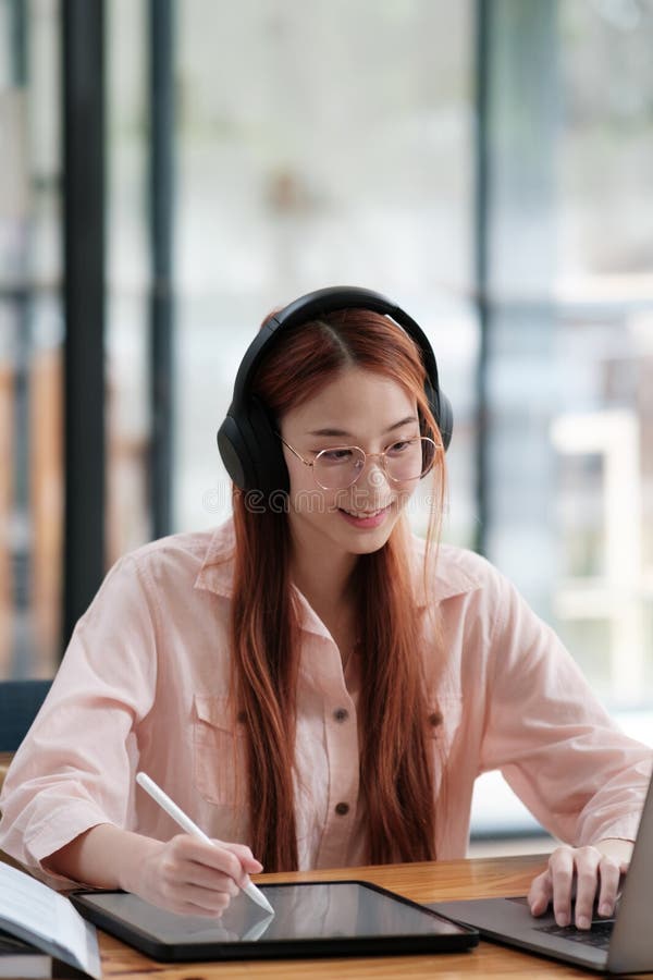 Young Collage Student Using Computer and Mobile Device Studying Online ...