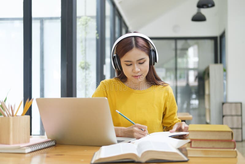 Young Collage Student Using Computer and Mobile Device Studying Online ...