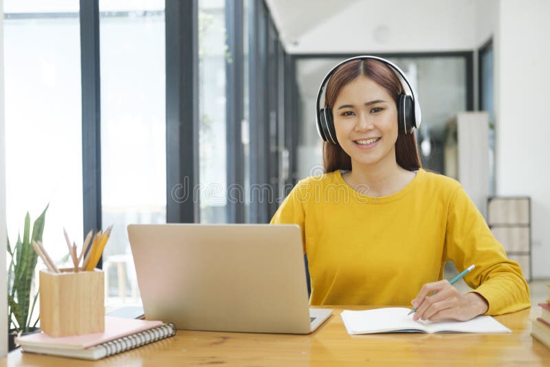 Young Collage Student Using Computer and Mobile Device Studying Online ...