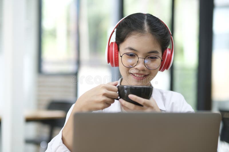 Young Collage Student Using Computer and Mobile Device Studying Online ...