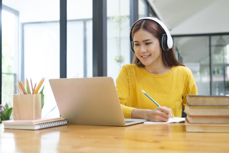 Young Collage Student Using Computer and Mobile Device Studying Online ...
