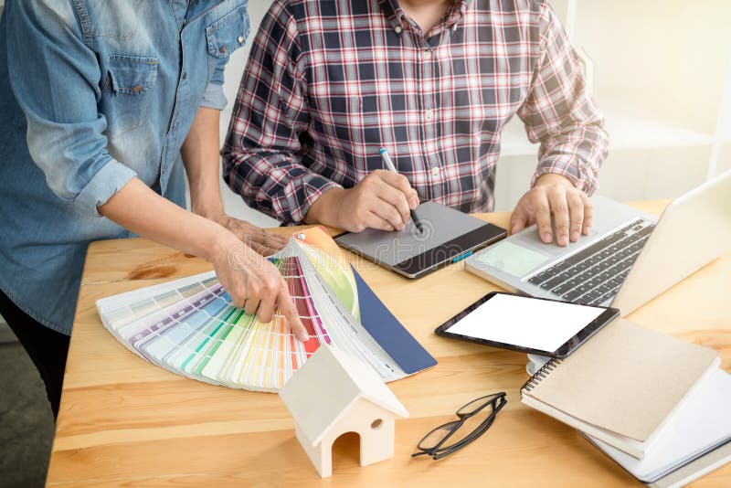 Young Colleagues Designers Working Together on a Creative Project and ...