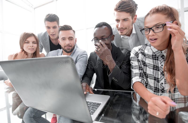 Young Colleagues Looking at Laptop with Smile on Face Stock Photo ...