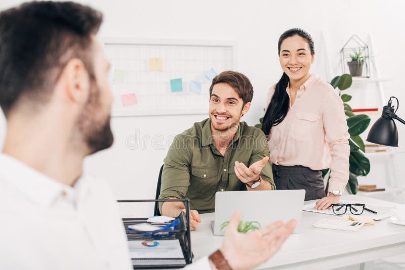 Young Colleagues Talking with Coworker Stock Image - Image of coworkers ...