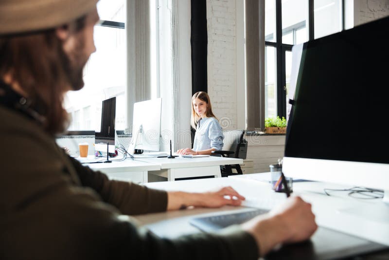 Young Colleagues Work in Office Using Computers Stock Image - Image of ...