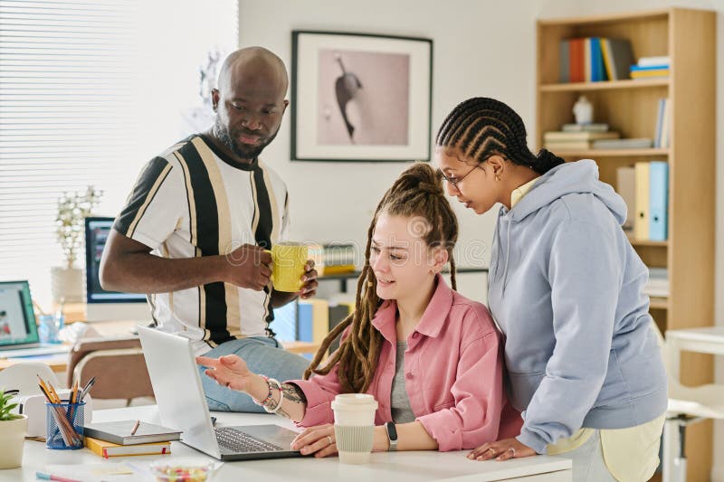 Young Colleagues Working with Program in Team Stock Photo - Image of ...