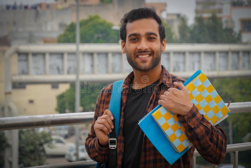 Young College Student with Books and Bag Enjoying and Smiling Stock ...