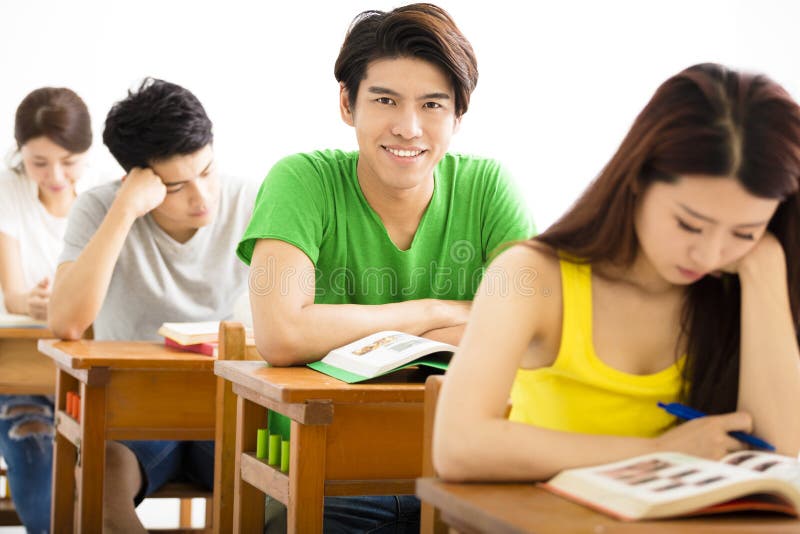 Young College Student Group Sitting in a Classroom Stock Image - Image ...
