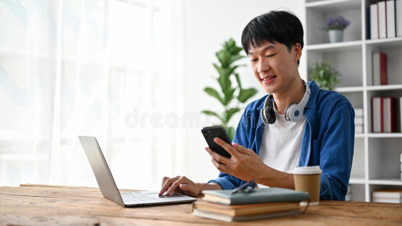 Young College Student Using Smartphone while Study in the Study Room ...