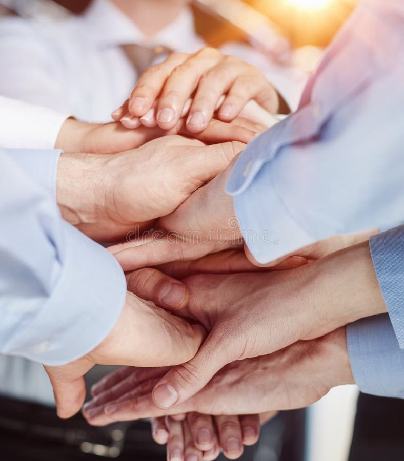 Young College Students Putting Their Hands on Top of Each Other ...