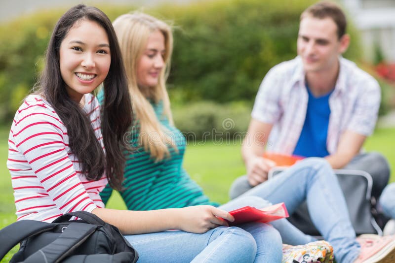 Young College Students Sitting in the Park Stock Image - Image of ...