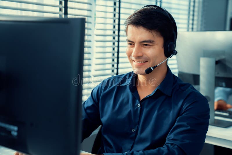 Young Competent Asian Male Call Center Agent Working in the Office ...