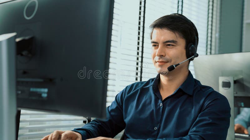 Male Call Center Operator or Telesales Agent Working on His Desk ...