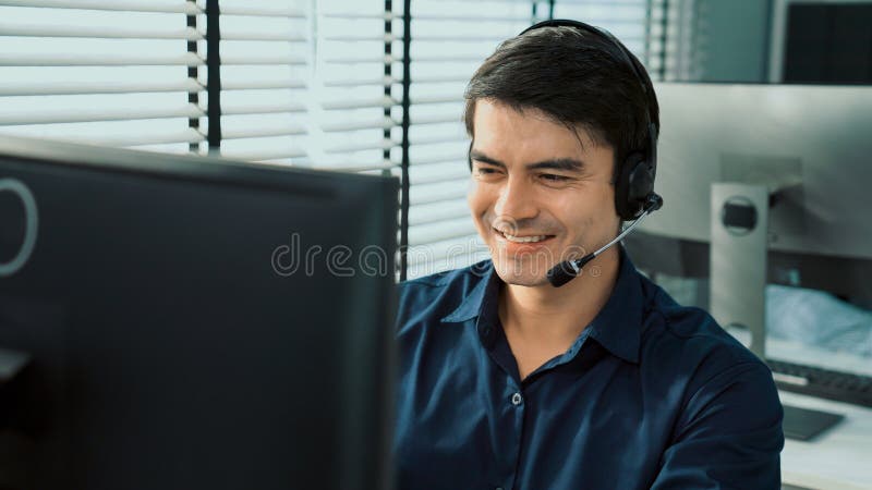 Young Competent Asian Male Call Center Agent Working in the Office ...