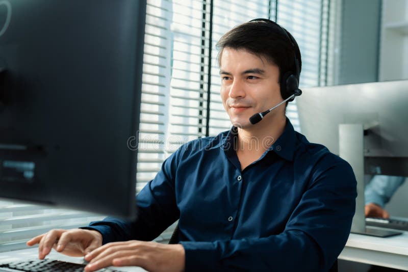 Young Competent Asian Male Call Center Agent Working in the Office ...