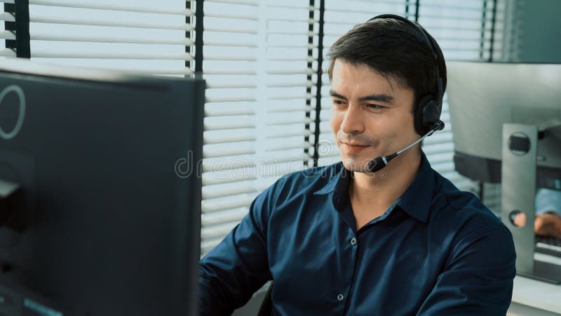 Young Competent Asian Male Call Center Agent Working in the Office ...