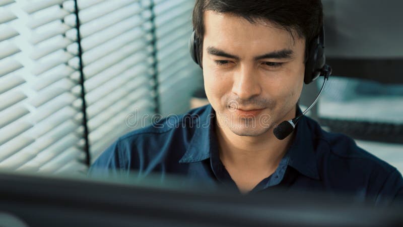 Young Competent Asian Male Call Center Agent Working in the Office ...