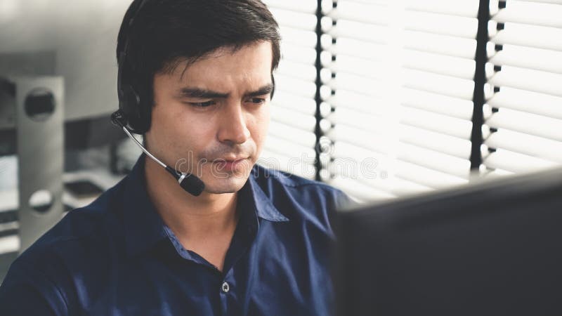 Young Competent Asian Male Call Center Agent Working in the Office ...
