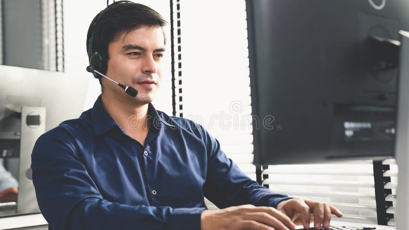 Young Competent Asian Male Call Center Agent Working in the Office ...