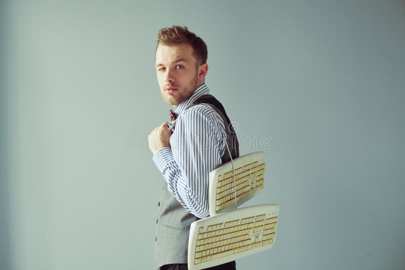 Young Computer Geek Carrying Keyboards Underhand Stock Photo - Image of ...