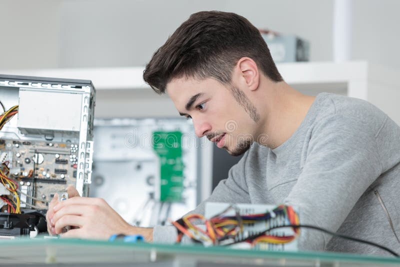 Young Computer Technician at Work Stock Photo - Image of indoors ...