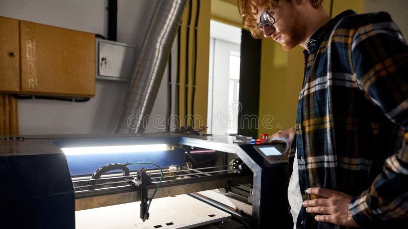 Concentrated Worker Operate CNC Machine on Factory Stock Image - Image ...