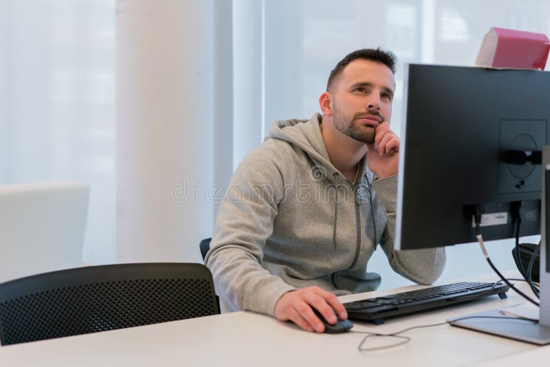 Young Concentrated Man Thinking about the Answer of the Questions in ...