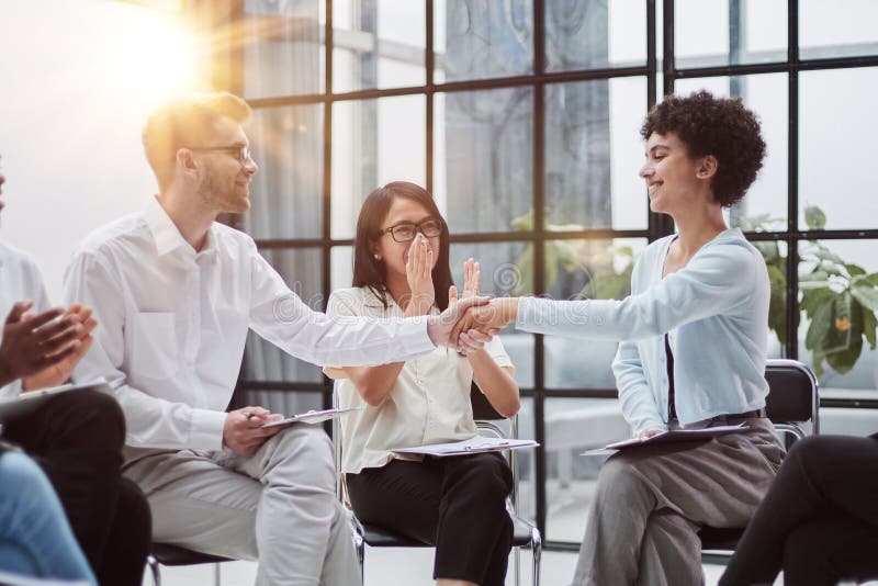 Young Confident Business People Joining Forces in the Office Stock ...