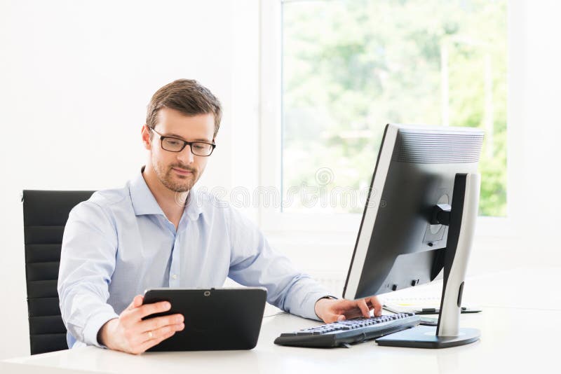 Young and Confident Businessman Working in a Modern Office Stock Image ...