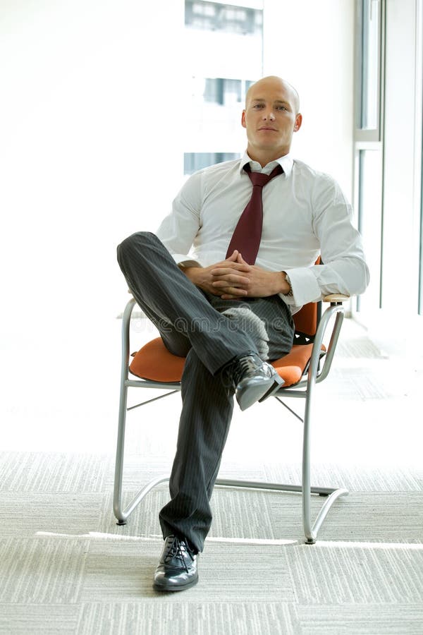 Young Confident Caucasian Businessman Sitting on Office Chair Stock ... Young Confident Caucasian Businessman Sitting on Office Chair Stock ...