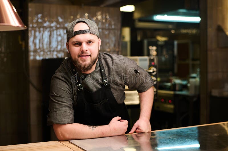 Young Confident Cook or Chef in Uniform Standing by His Workplace in ...