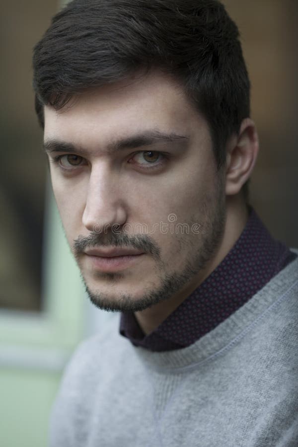 Young Confident Man in Sweater Looking Very Serious Stock Photo - Image ...