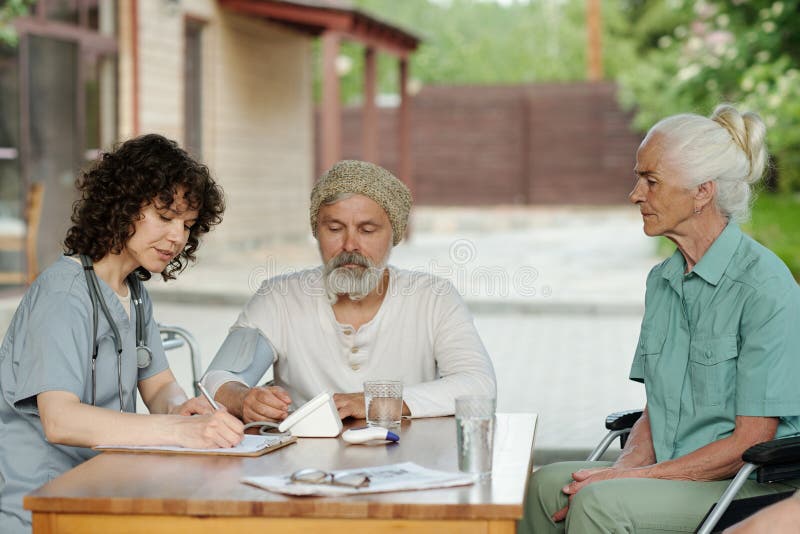 Young Confident Nurse Making Prescriptions or Medical Notes in Document ...