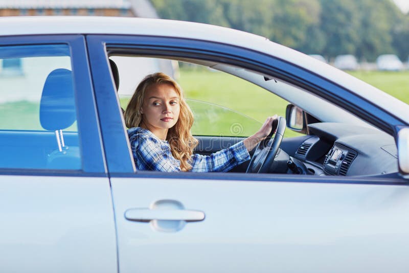 Young Confident Woman Driving a Car Stock Image - Image of light, belt ...