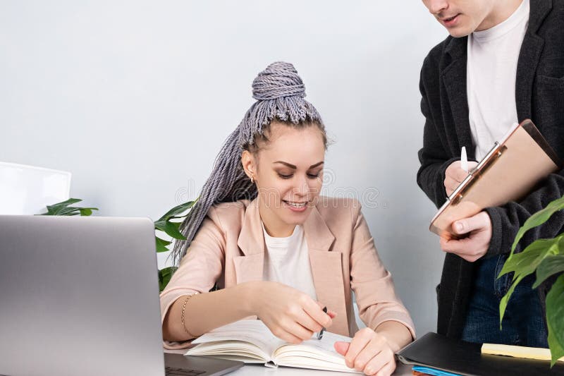 Young Confident Woman Leader Explains Something To Her Assistant ...