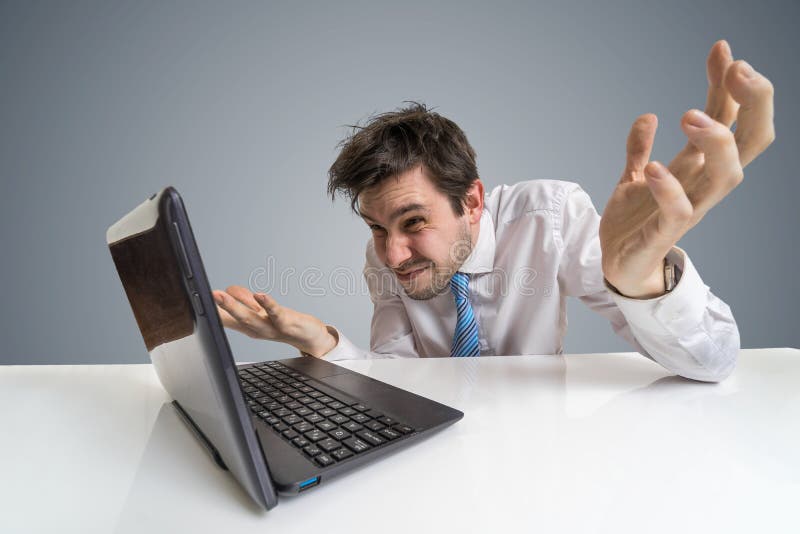 Young Confused and Unsure Man is Working with Laptop Stock Photo ...