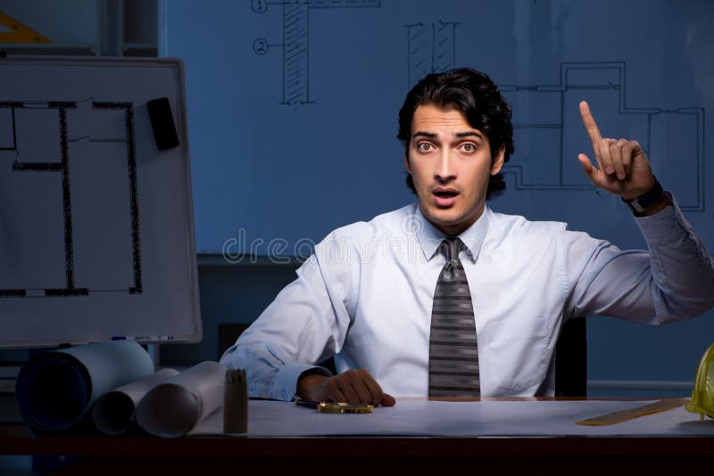 The Young Construction Architect Working on Project at Night Stock ...