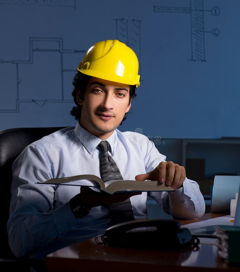 Young Construction Architect Working on Project at Night Stock Image ...