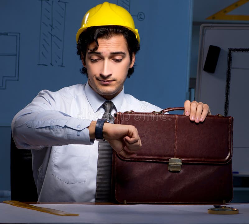 Young Construction Architect Working on Project at Night Stock Photo ...