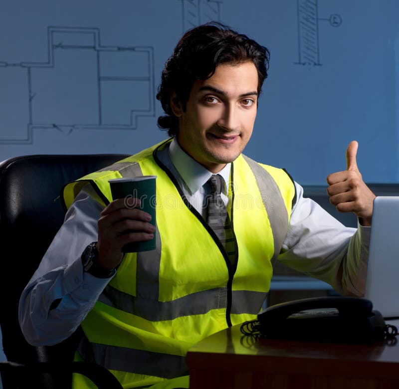 Young Construction Architect Working on Project at Night Stock Photo ...