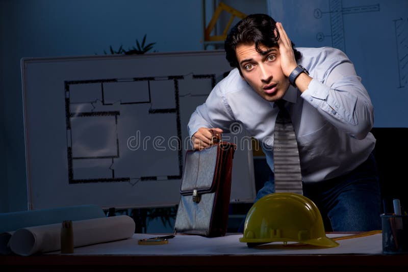 The Young Construction Architect Working on Project at Night Stock ...